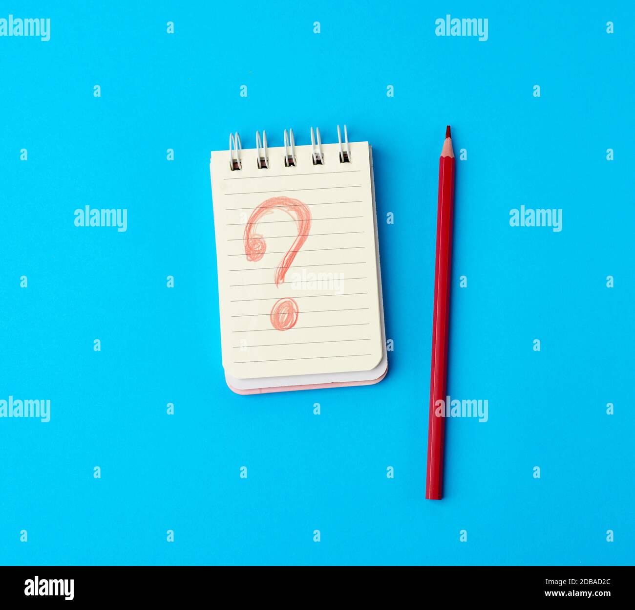 notebook in line and wooden red pencil on a blue background, drawn ...