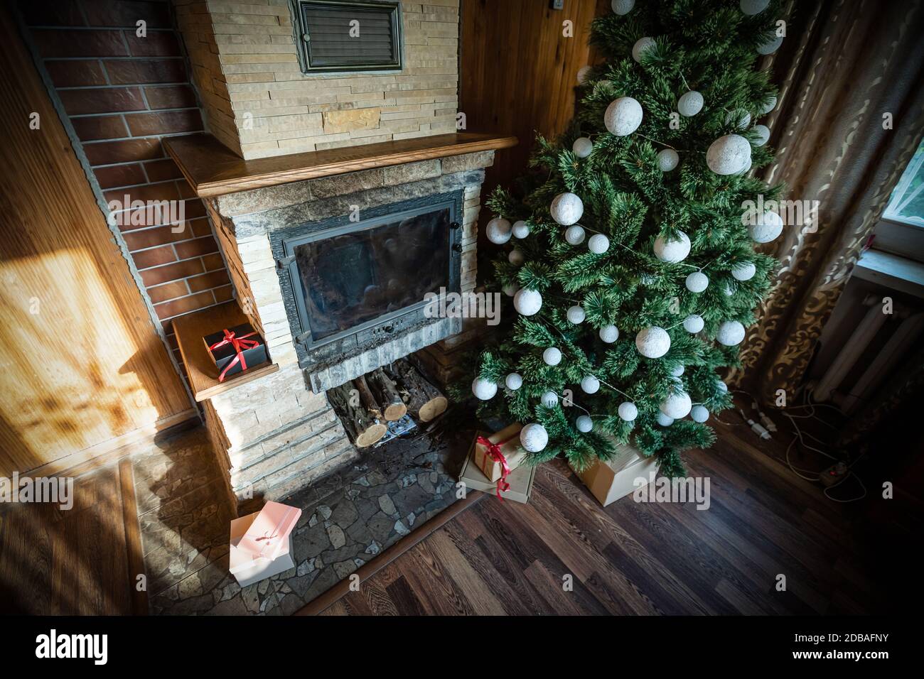 Interior of wooden chalet with christmas tree Stock Photo - Alamy