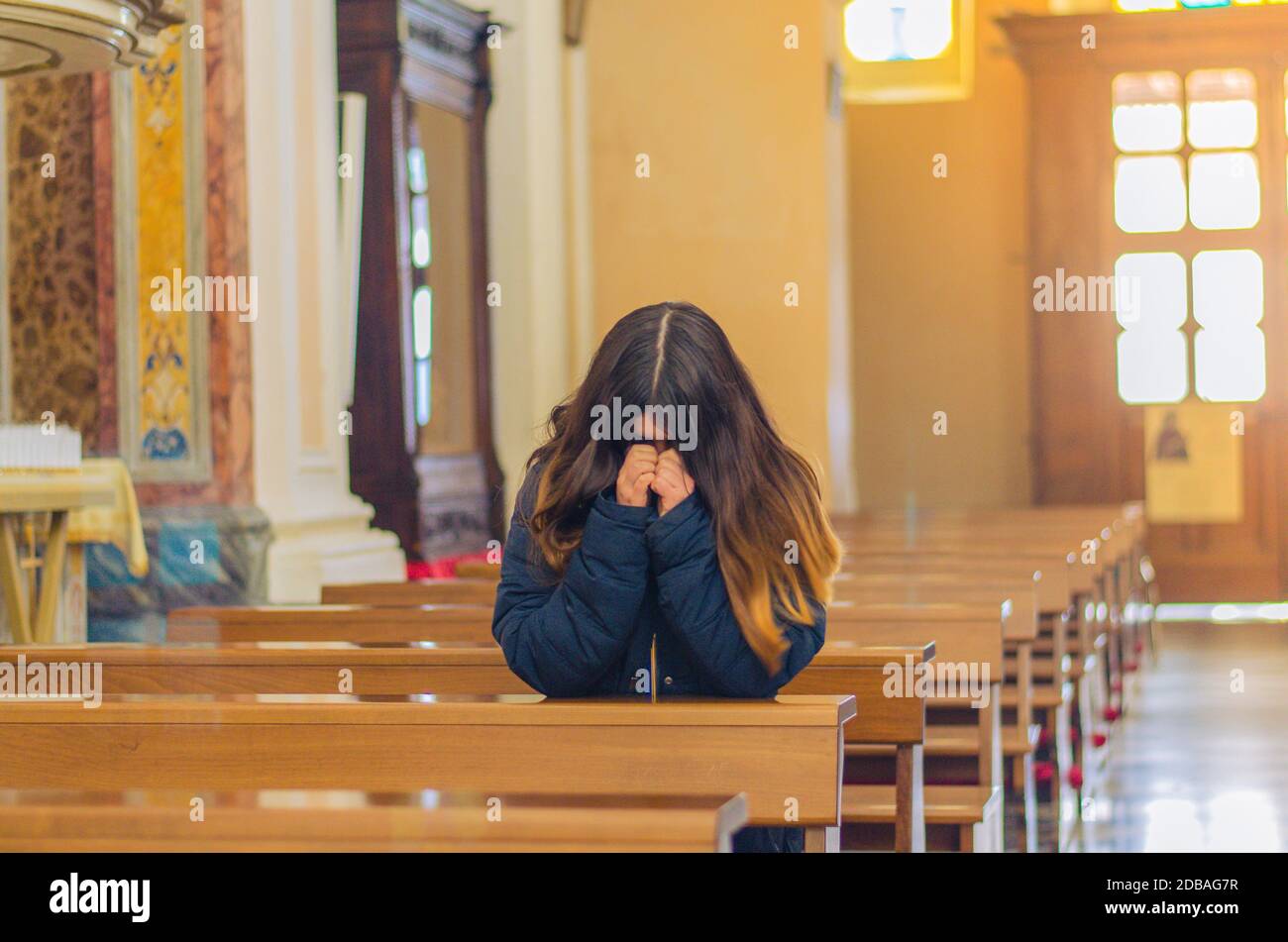 christian woman praying in catholic church Stock Photo - Alamy