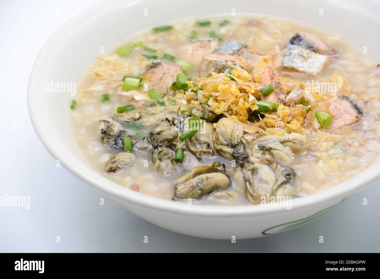 Seafood boiled rice with Salmon and Oysters Stock Photo - Alamy