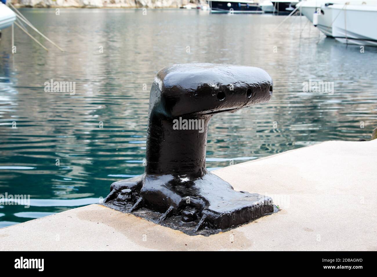 a bollard on a quay wall in the harbor basin for fastening ships Stock ...