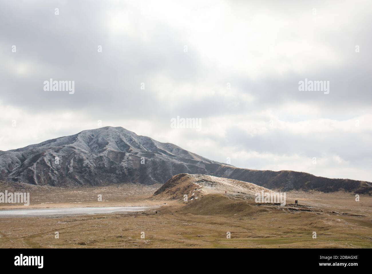 Mount Aso and Kusasenri in winter. covered by golden yellow grassland - Kumamoto, Japan Stock ...