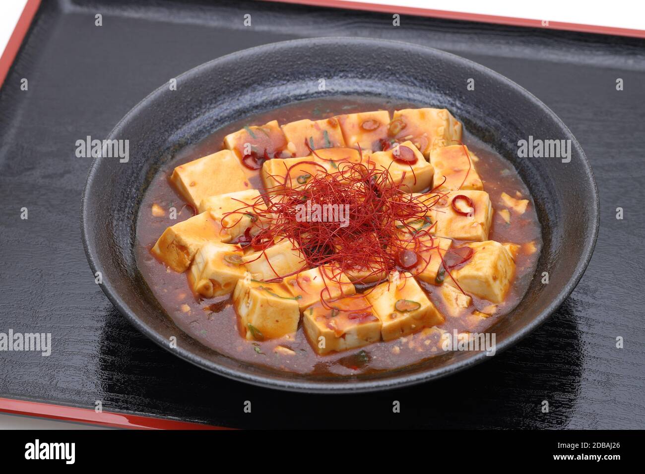 Chinese cuisine mapo doufu in a dish on wooden tray Stock Photo - Alamy