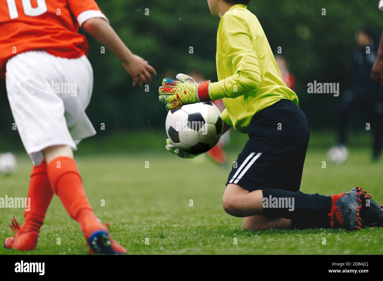Junior Soccer Football Goalkeeper Catching Ball. Goalie in Action on ...