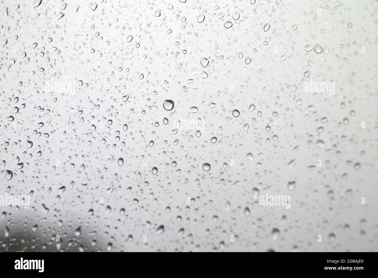 Drops of rain on the inclined window (glass). Shallow DOF Stock Photo ...