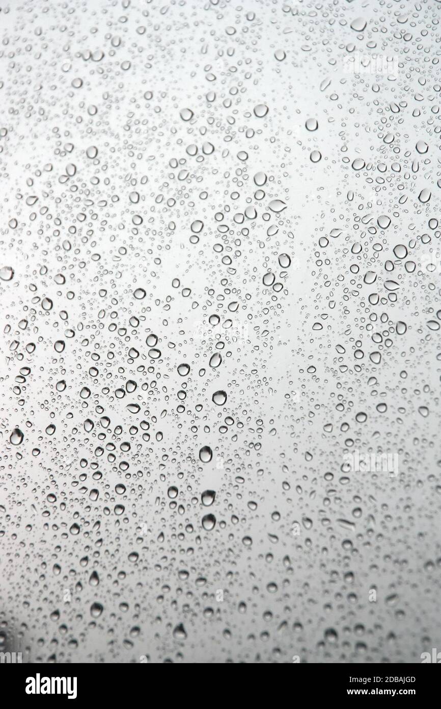 Drops of rain on the inclined window (glass). Shallow DOF Stock Photo ...