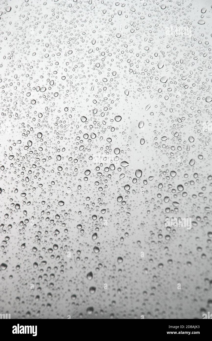 Drops of rain on the inclined window (glass). Shallow DOF Stock Photo ...