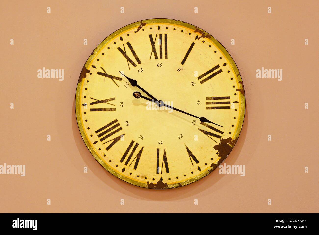 Circle old retro style clock hanging on wall Stock Photo - Alamy