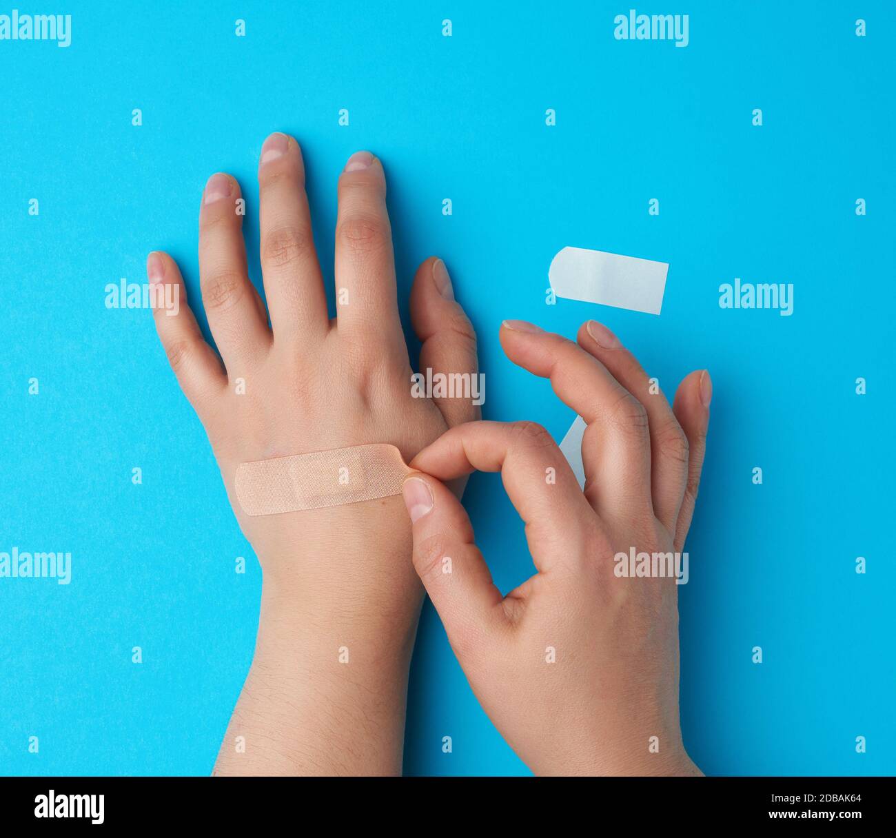 Blue plaster on finger hi-res stock photography and images - Alamy
