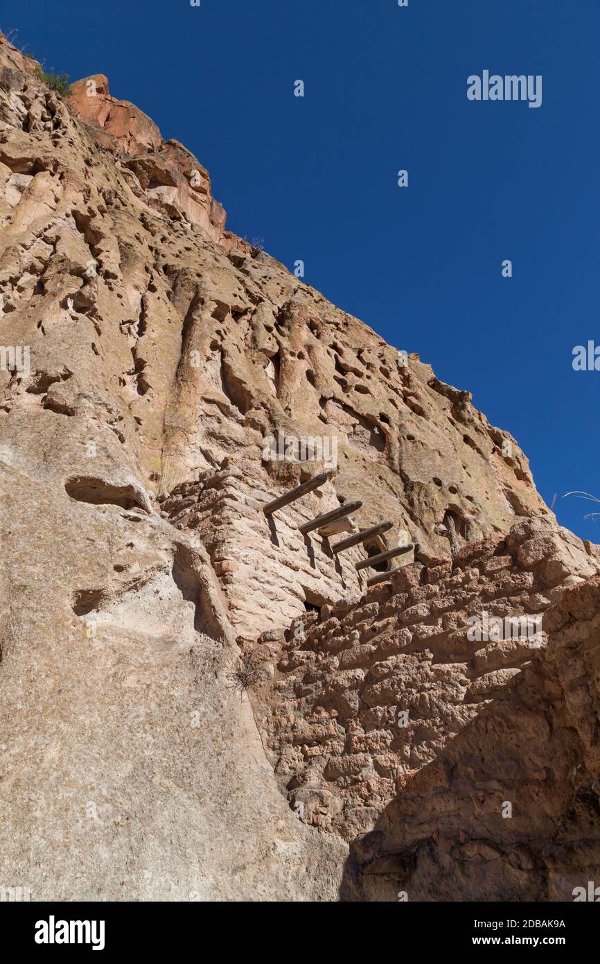 A building made of brick and clay with wooden poles to support a roof ...