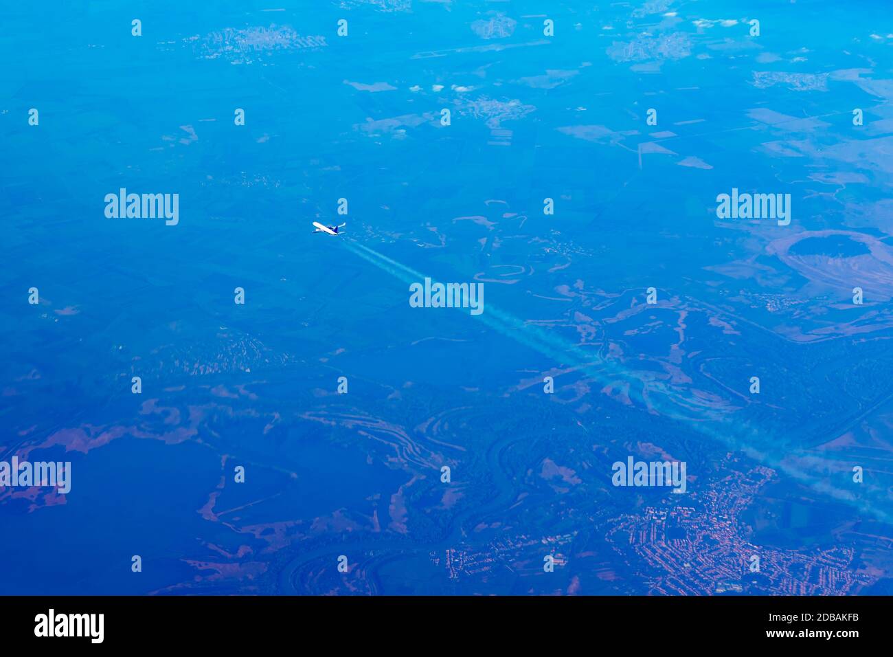 Aerial view of airplane flying over the earth Stock Photo - Alamy