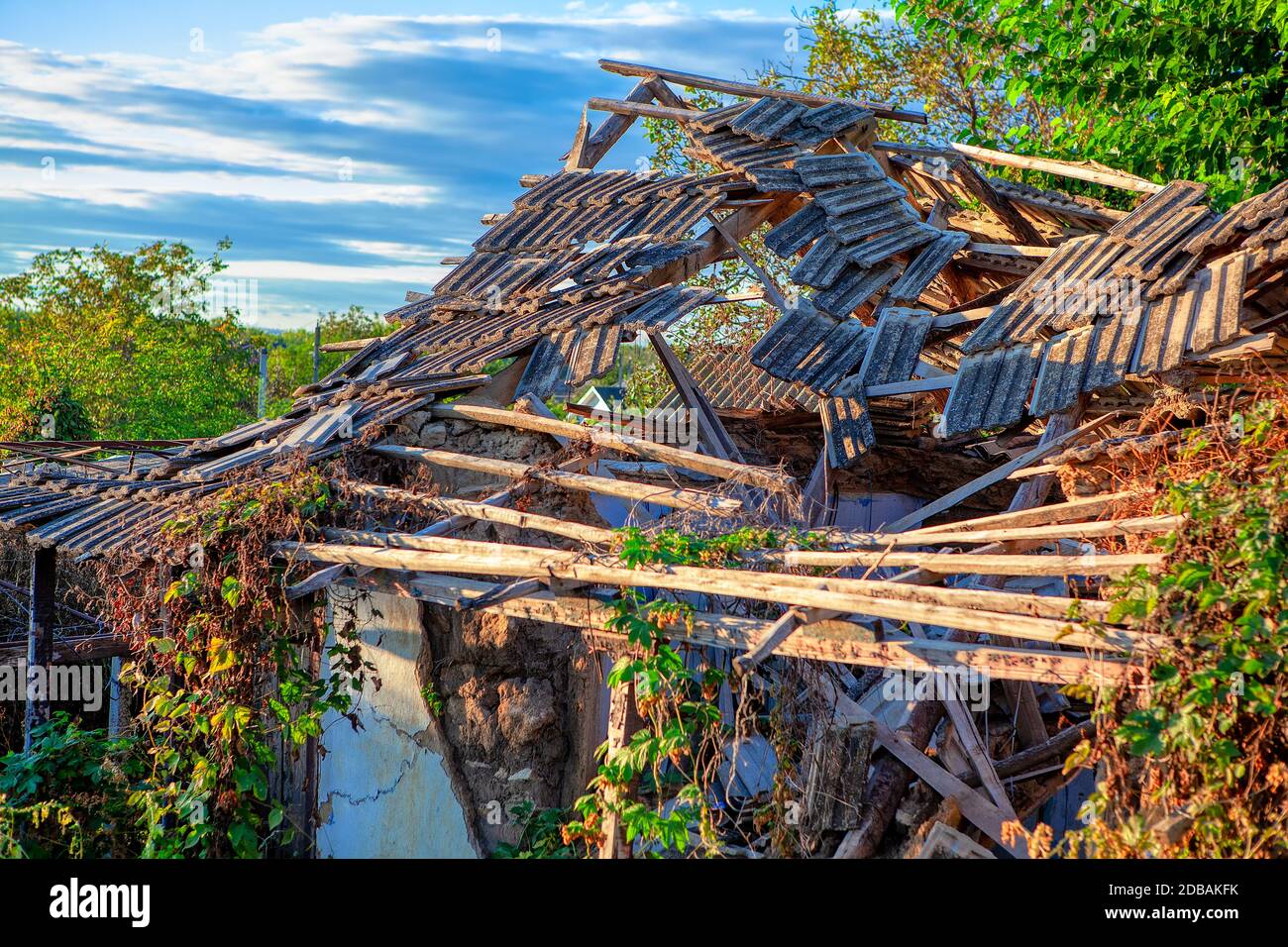 Destroyed country house with broken roof Stock Photo - Alamy