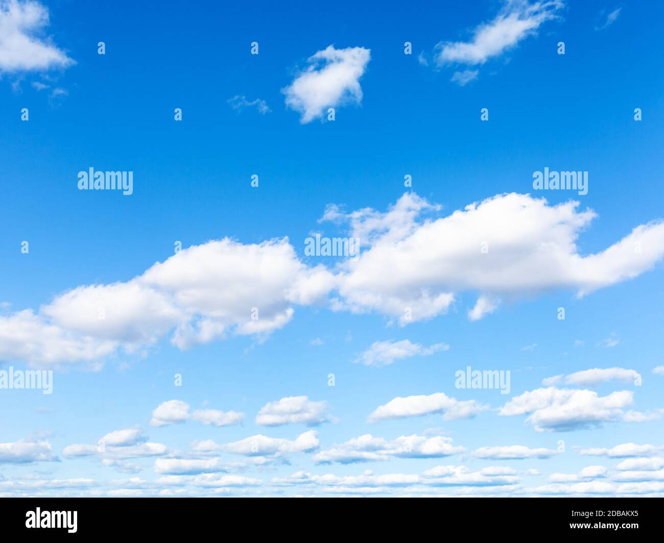 blue sky with white cumulus clouds on sunny March day Stock Photo - Alamy
