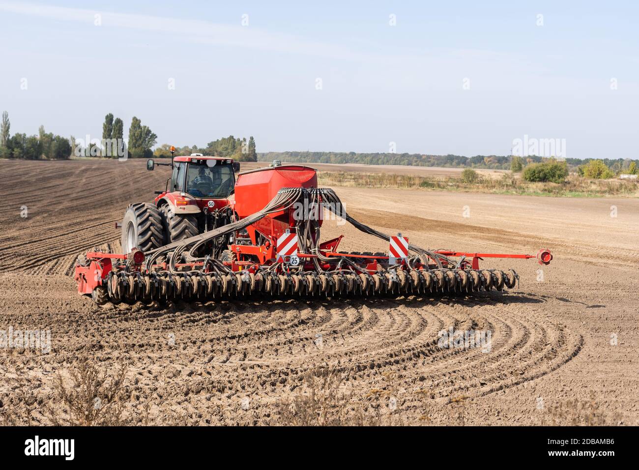 Tractor cultivating soil and preparing a field for planting Stock Photo ...