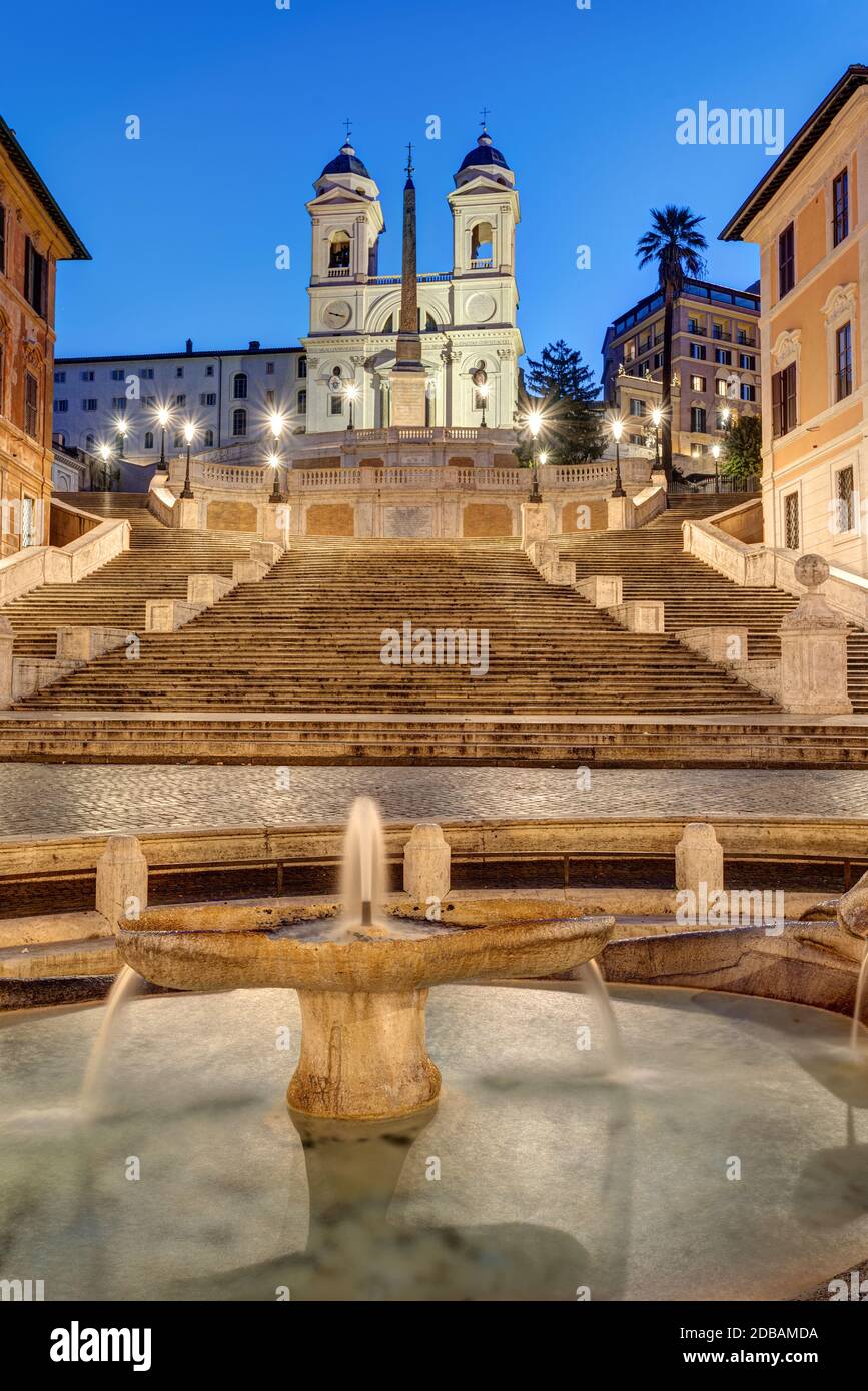 The famous Spanish Steps with a fountain in Rome at dawn Stock Photo ...