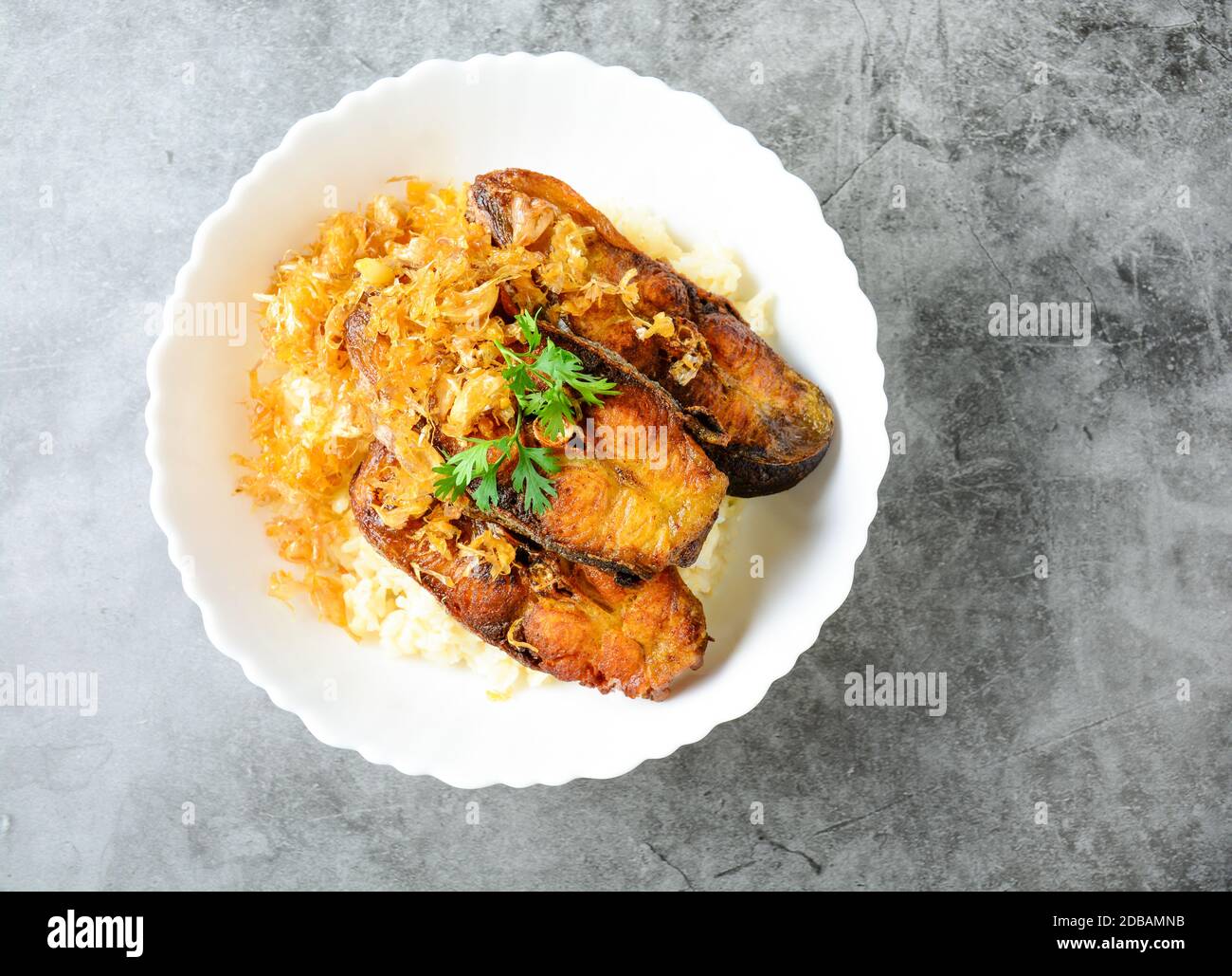 Deep fried sliced Pangasius fish with garlic, served with brown rice ...