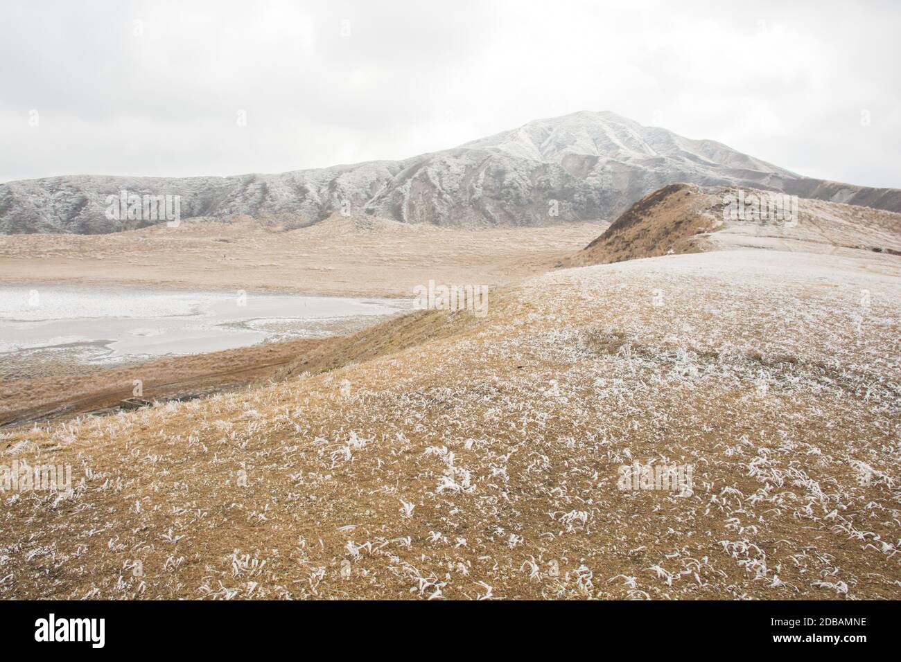 Mount Aso and Kusasenri in winter. covered by golden yellow grassland - Kumamoto, Japan Stock ...