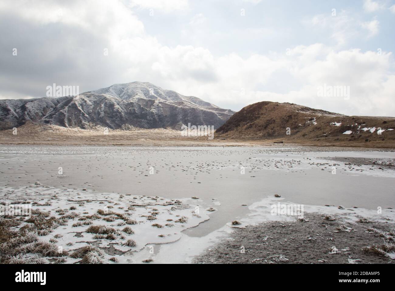 Mount Aso and Kusasenri in winter. covered by golden yellow grassland - Kumamoto, Japan Stock ...