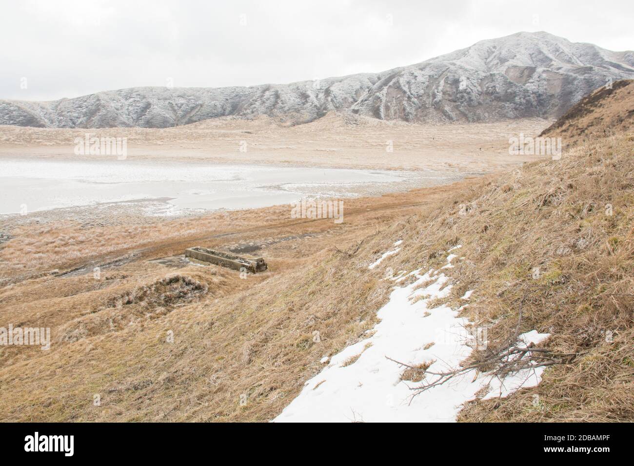 Mount Aso and Kusasenri in winter. covered by golden yellow grassland - Kumamoto, Japan Stock ...