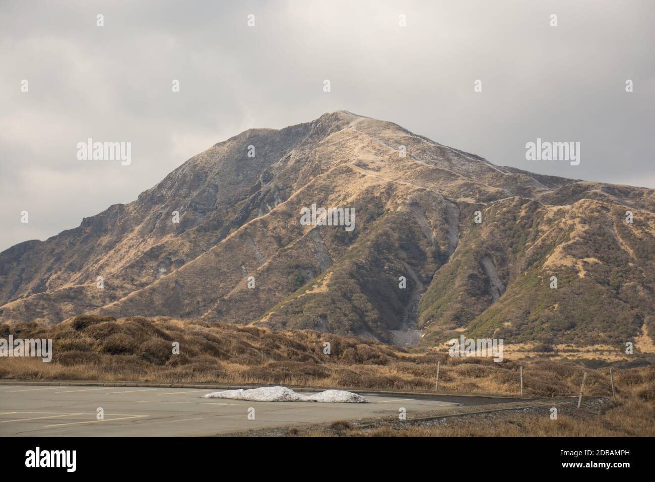 Mount Aso and Kusasenri in winter. covered by golden yellow grassland - Kumamoto, Japan Stock ...