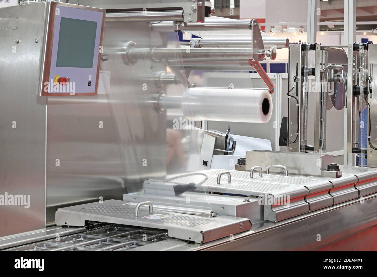 Foil Packing Machine at Production Line in Food Factory Stock Photo - Alamy