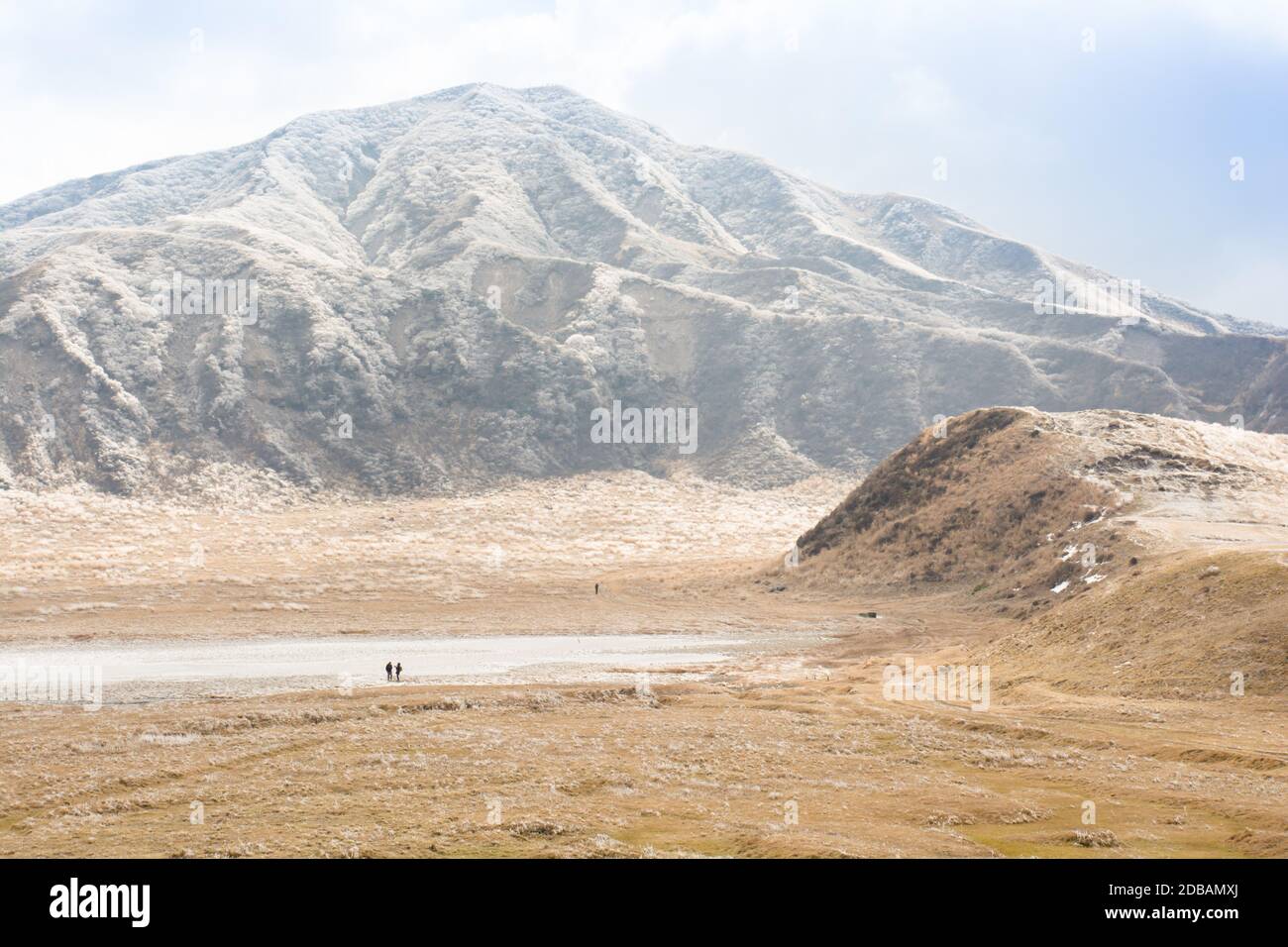 Mount Aso and Kusasenri in winter. covered by golden yellow grassland - Kumamoto, Japan Stock ...