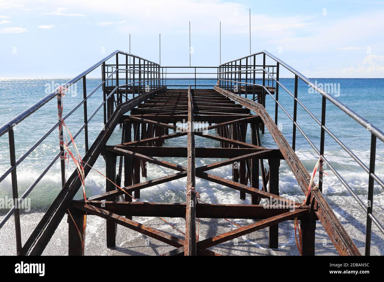 Hard rust pier construction on sea beach Stock Photo - Alamy