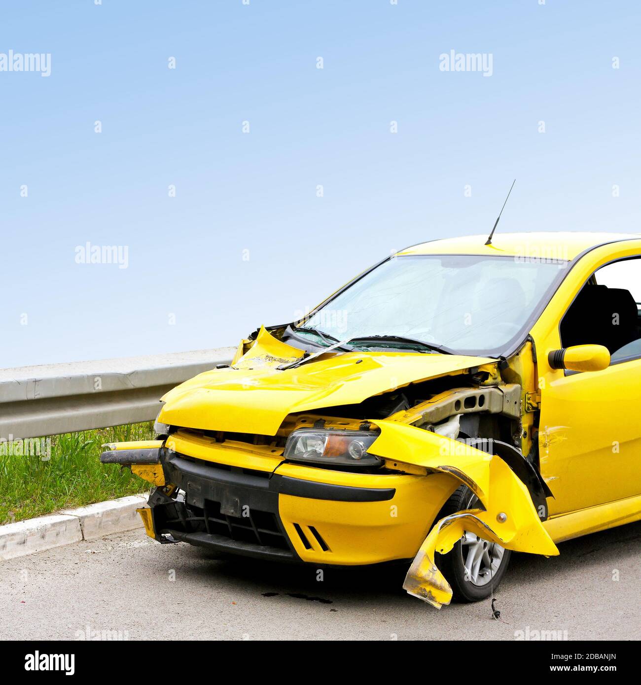 Front view of crashed yellow car at highway Stock Photo - Alamy