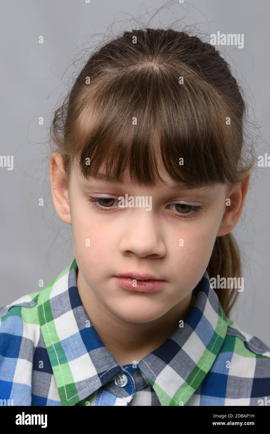 Portrait of a sad ten-year-old girl of European appearance, close-up ...