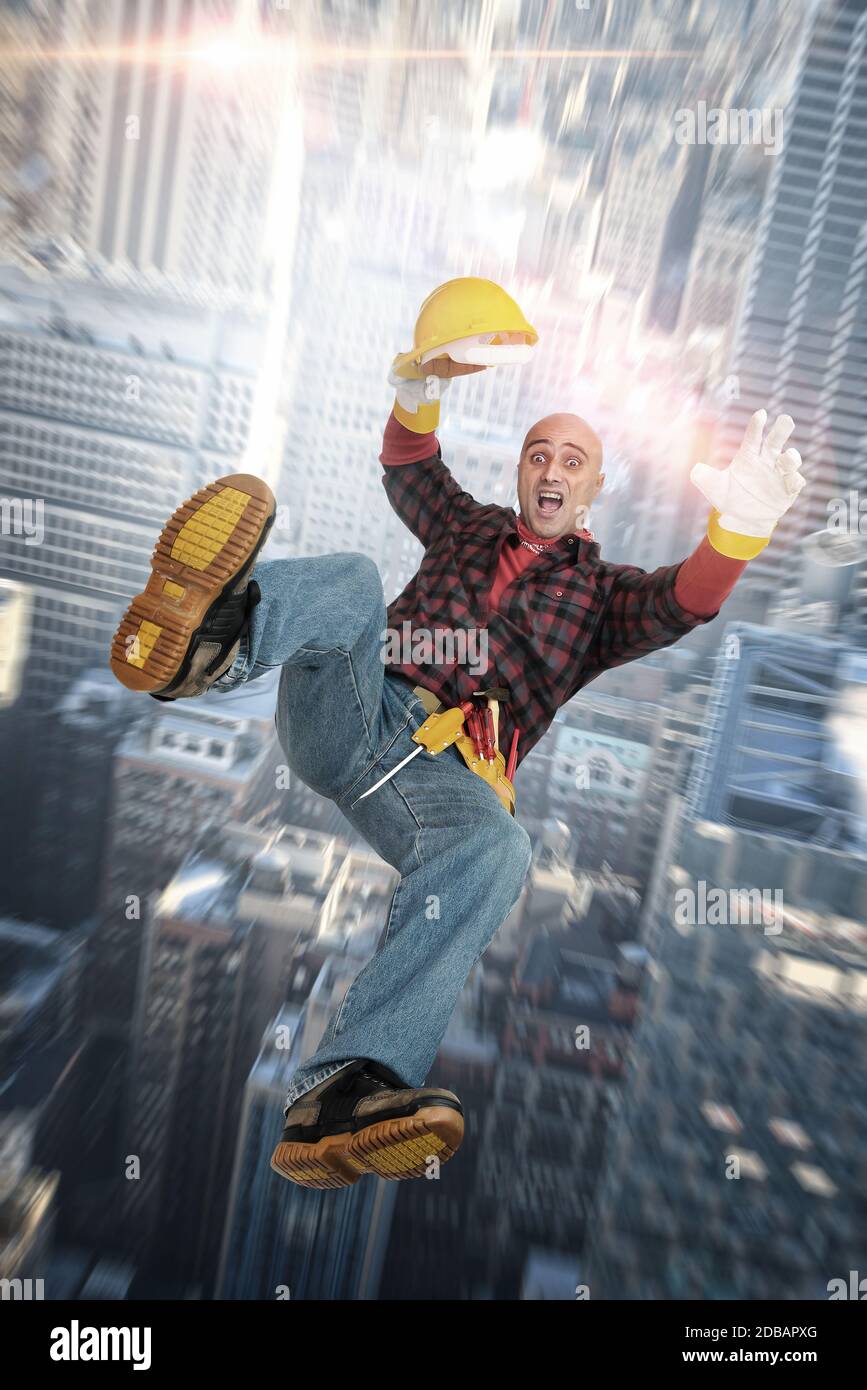 Construction worker falling from the top of a building Stock Photo - Alamy