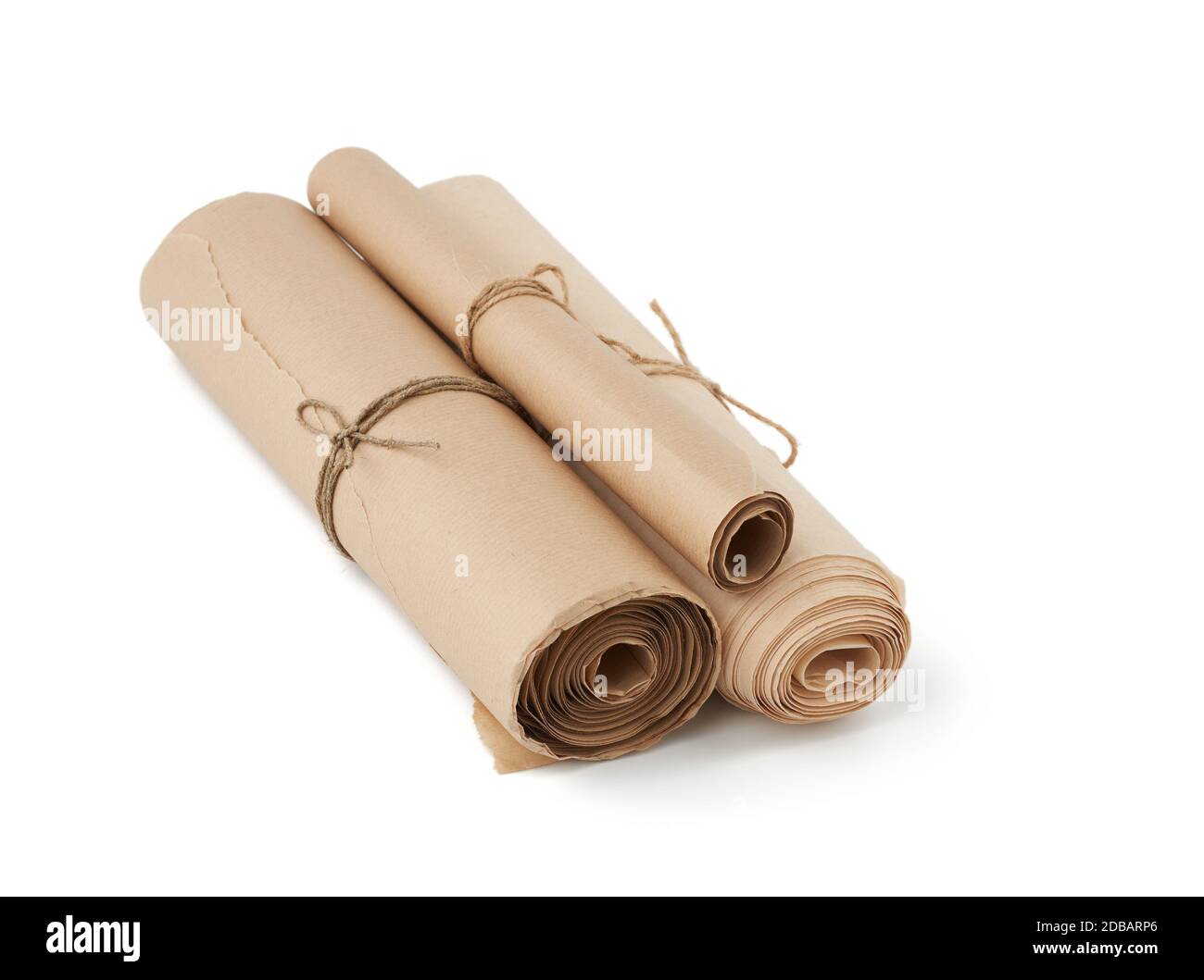 stack of twisted rolls of brown paper isolated on white background ...