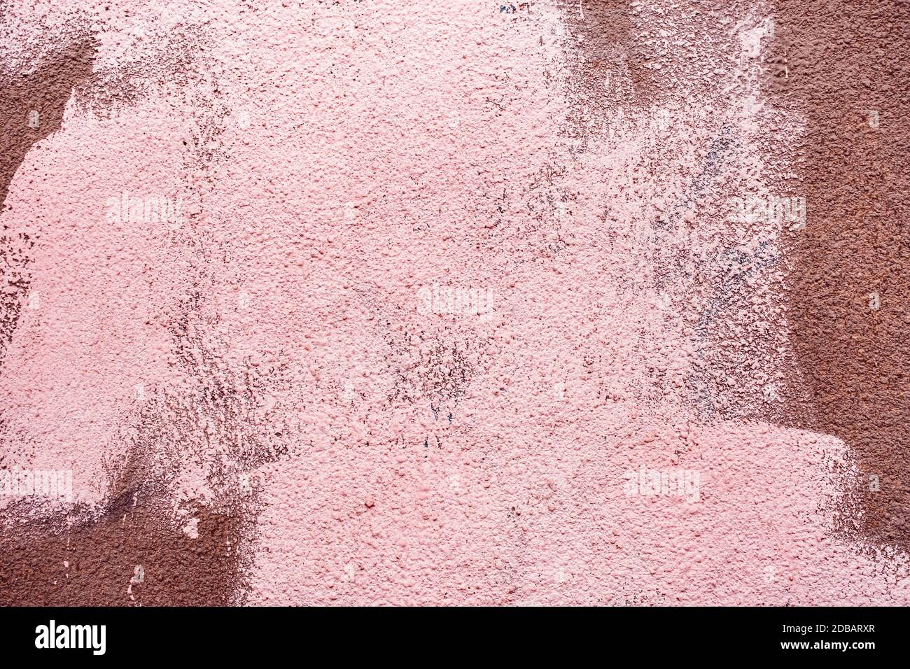 Concrete gray wall with pink paint spot texture or background. High ...