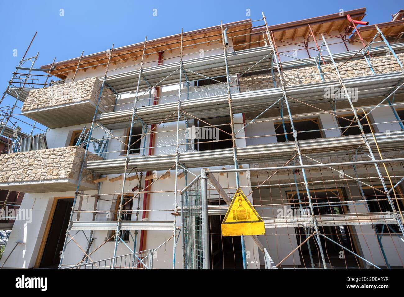 Scaffolding near a house under construction for external plaster works ...