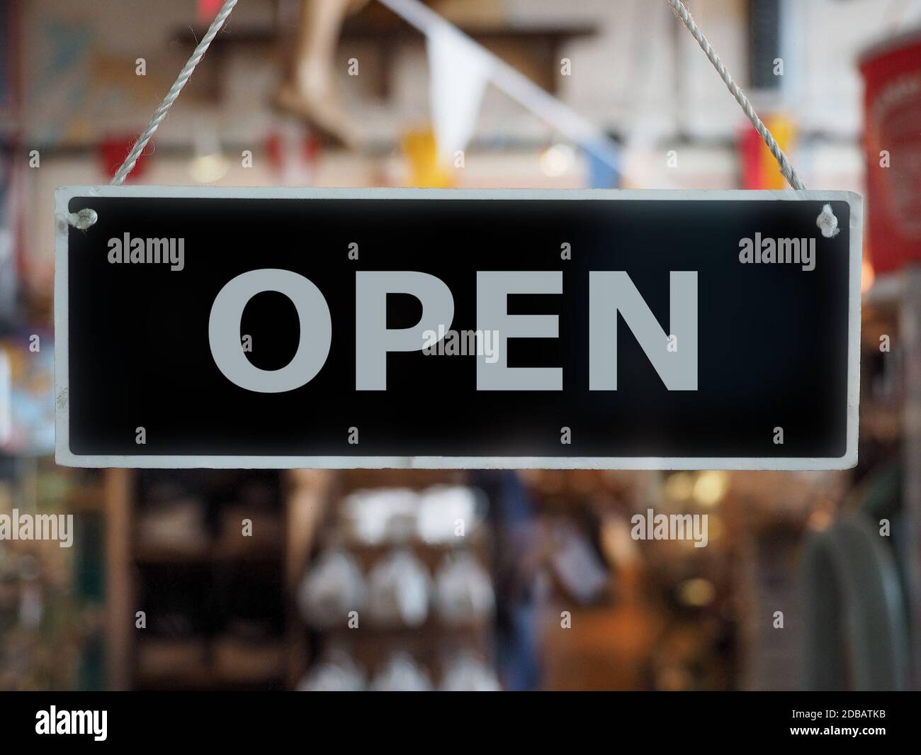 Open sign in a shop window with reflections Stock Photo - Alamy