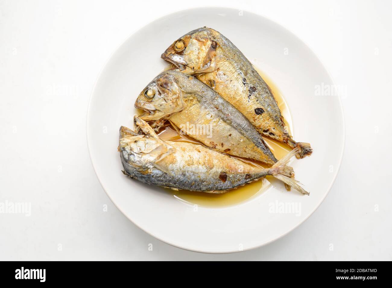 Fried mackerel on white plate. Deep fried fish Stock Photo - Alamy