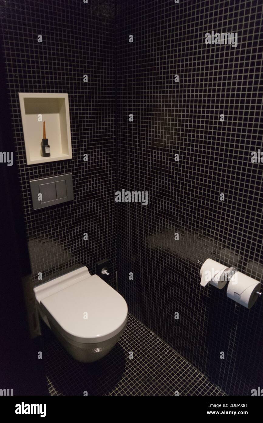 Bathroom / toilet with black mosaic tiles Stock Photo - Alamy