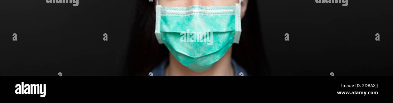 Banner with a women wearing a medical facial protection mask. Future ...