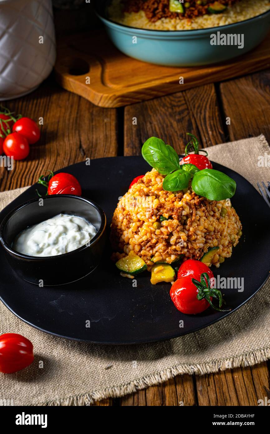 rustic bulgur fried with minced meat and vegetables Stock Photo - Alamy