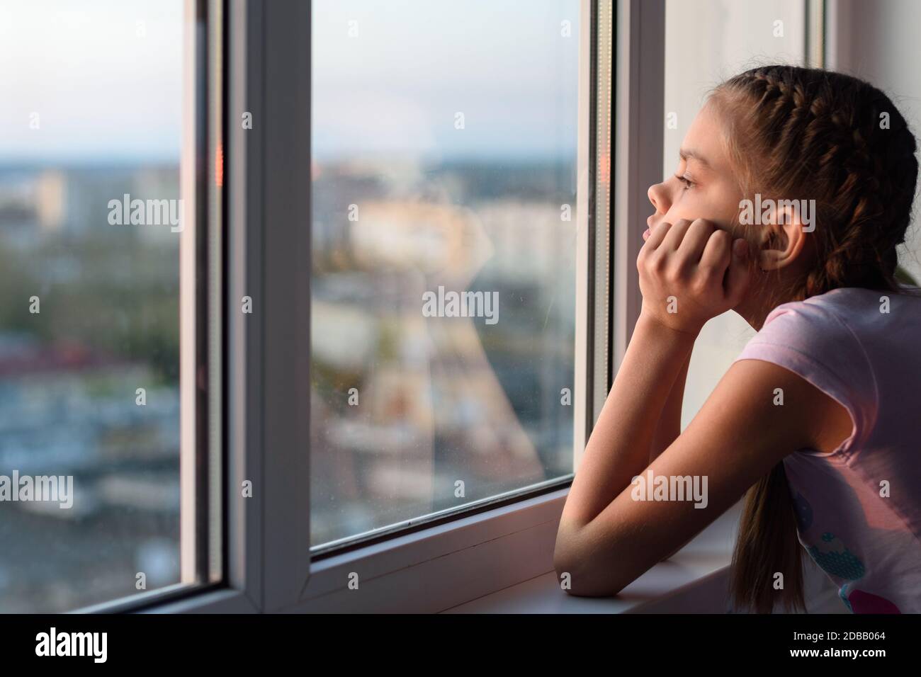 Child looking out window house sad hi-res stock photography and images ...