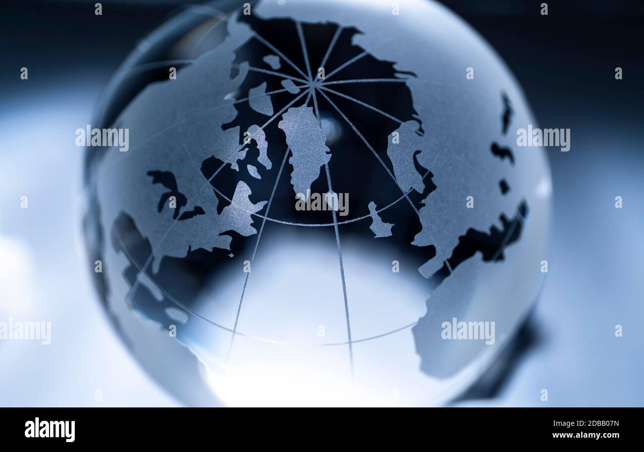 Glass globe on gray background Stock Photo - Alamy