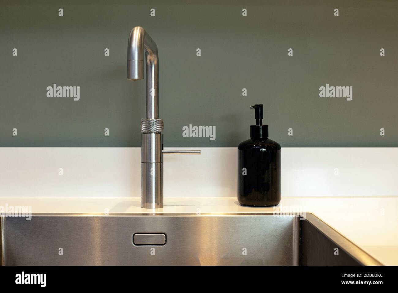Empty clean kitchen sink and soap dispenser modern design with grey ...