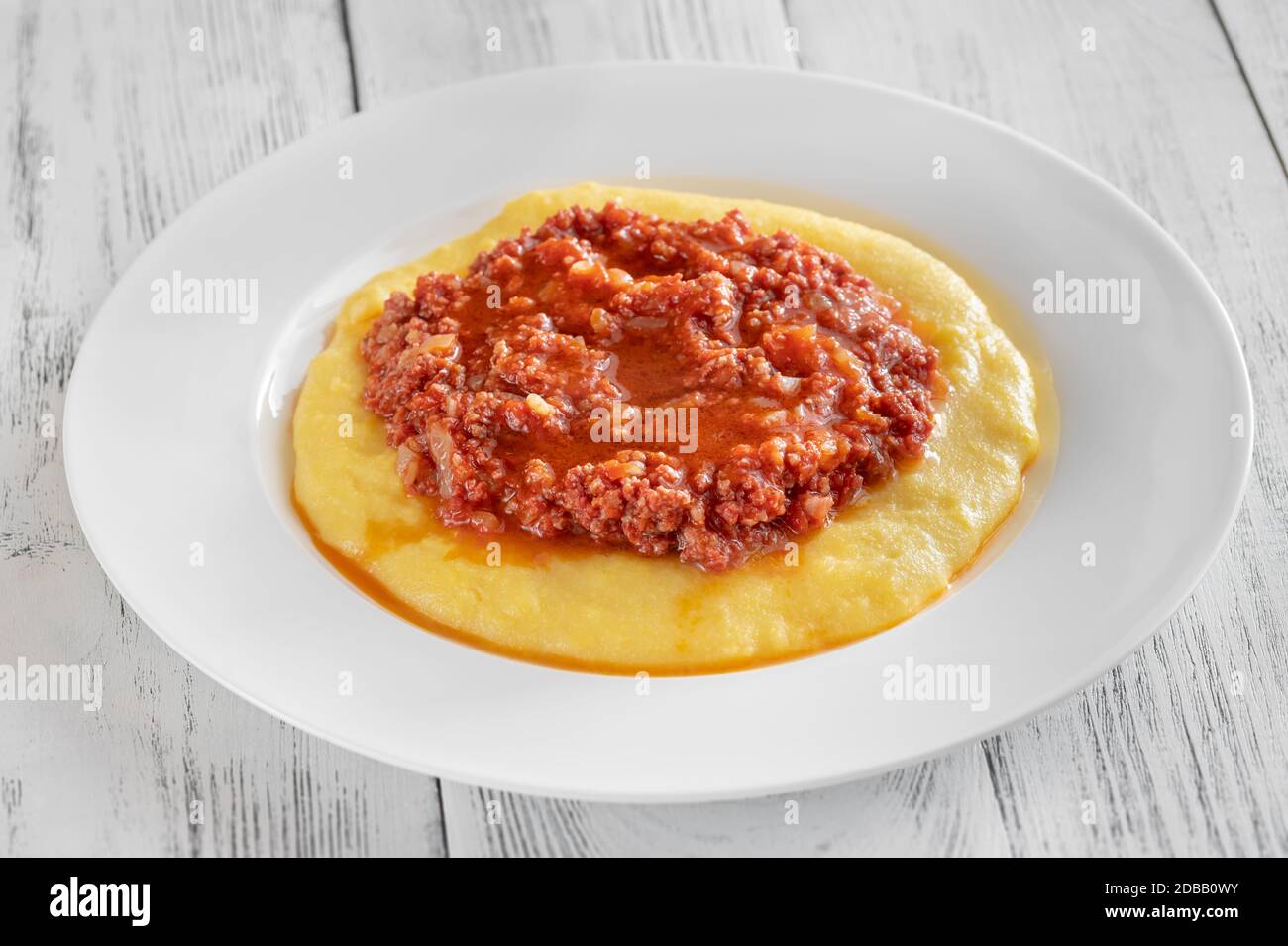 Italian cornmeal polenta with bolognese sauce Stock Photo - Alamy