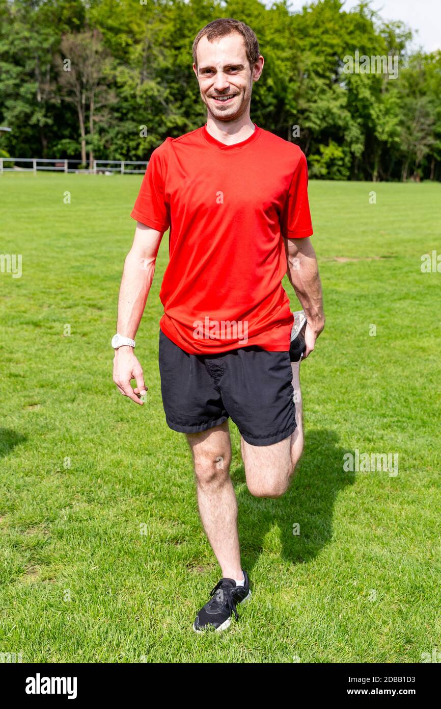 Handsome young sportsman doing exercises hi-res stock photography and ...