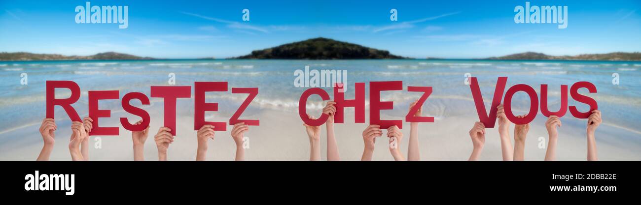 People Hands Holding Colorful French Word Restez Chez Vous Means Stay ...