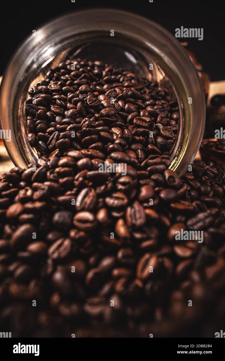 Spilled coffee beans, coffee beans in a jar Stock Photo - Alamy