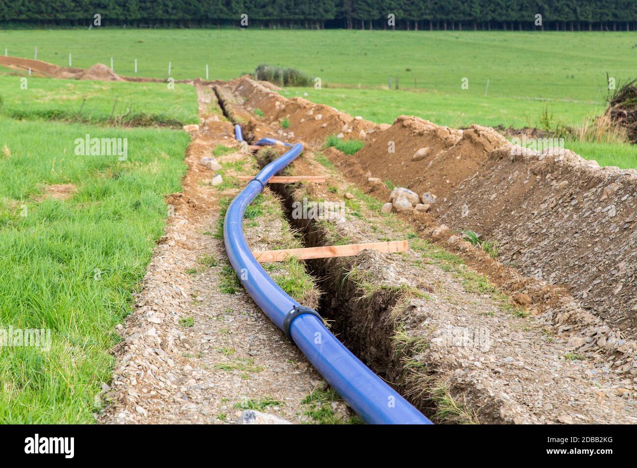 Pipe laying construction site on a meadow Stock Photo - Alamy