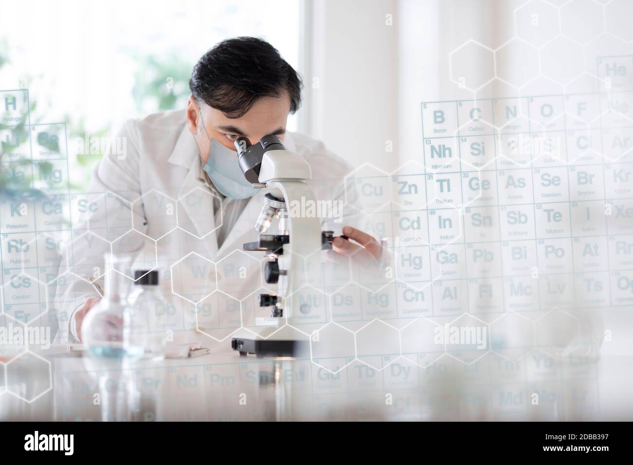 Doctor using microscope Stock Photo - Alamy