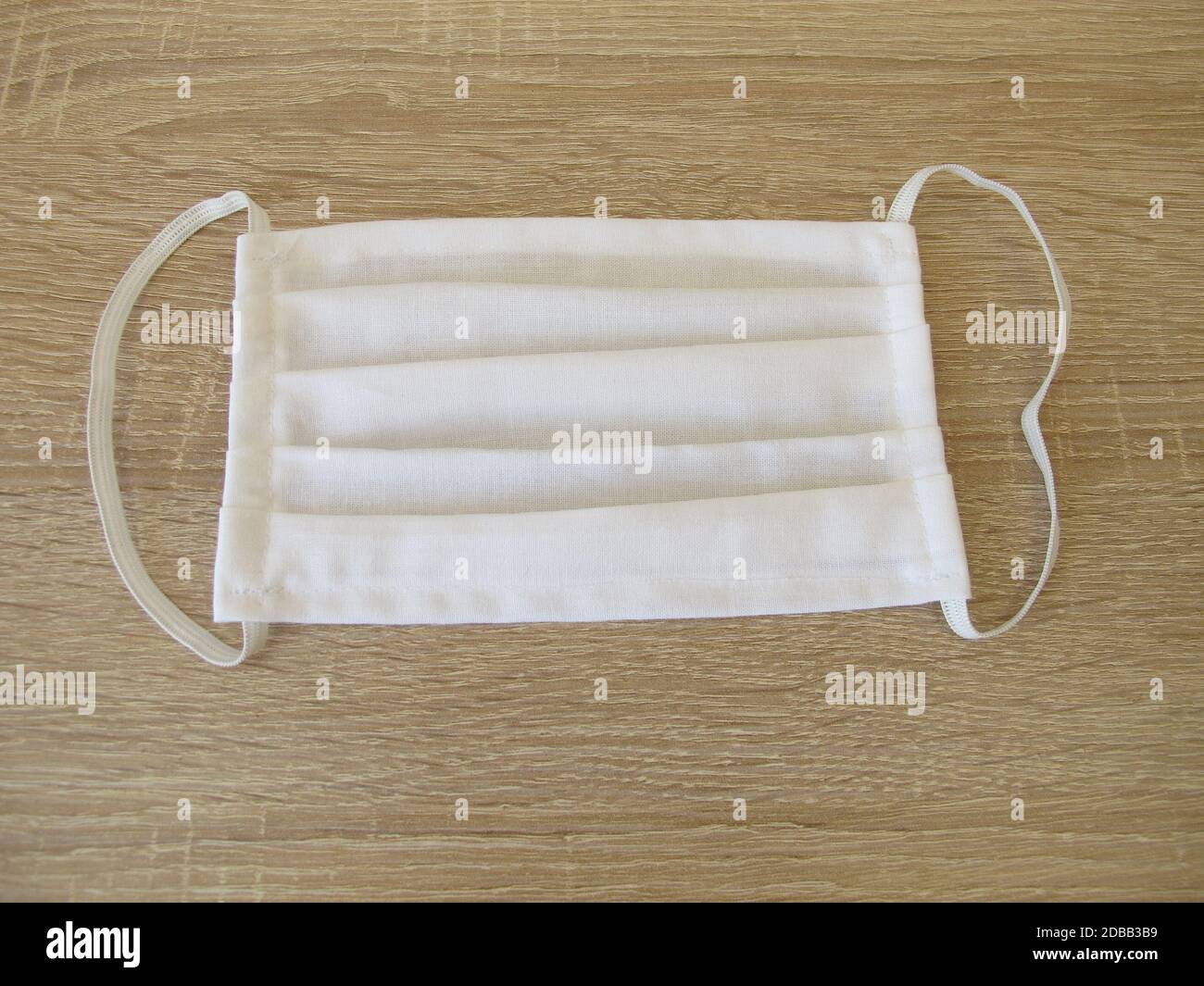 Self-sewn fabric face mask made of white cotton Stock Photo - Alamy