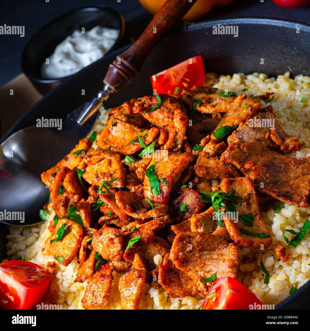 rustic bulgur pans with gratinated gyros and yoghurt Stock Photo - Alamy
