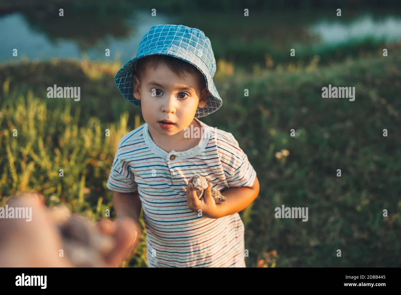 Collecting stone child hi-res stock photography and images - Alamy